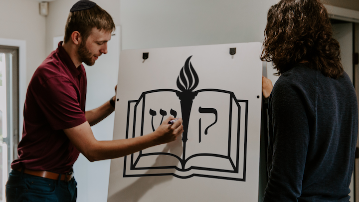 Synagogue Unveils Revolutionary New Logo, Features Fire, Book